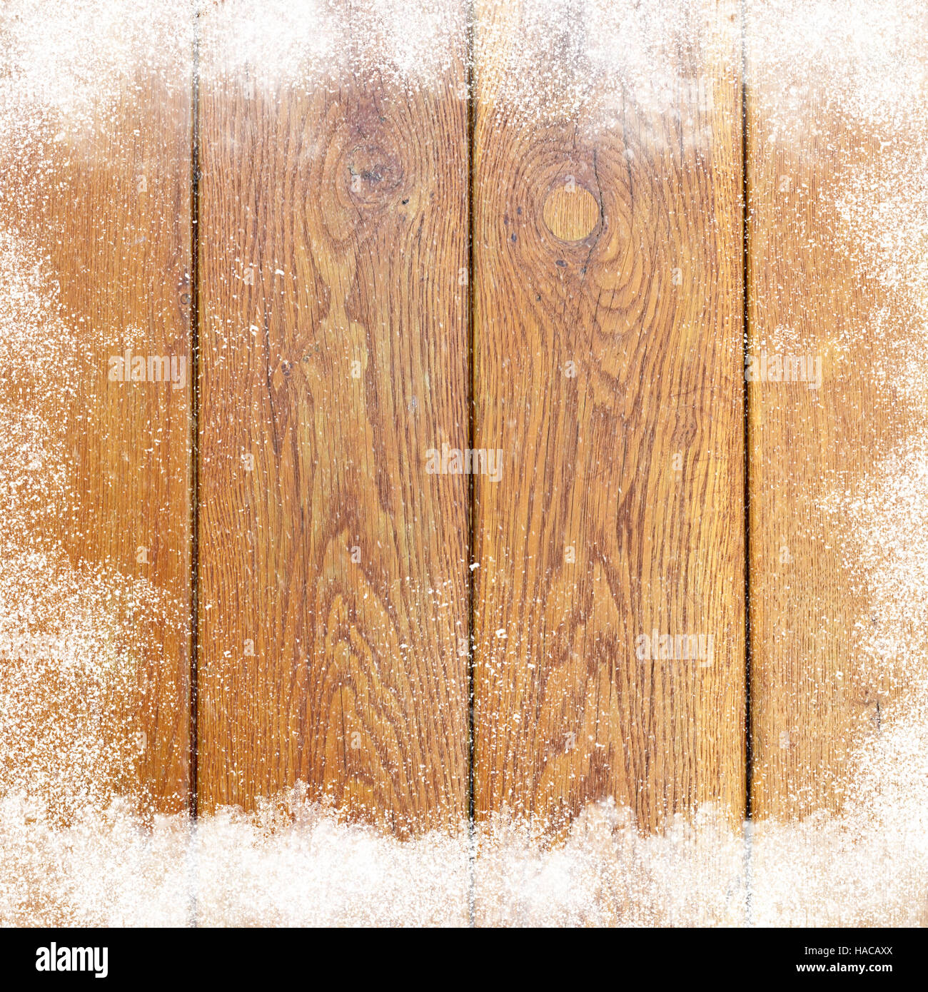 Winter background with snowfall on the old wooden barn wall and ...