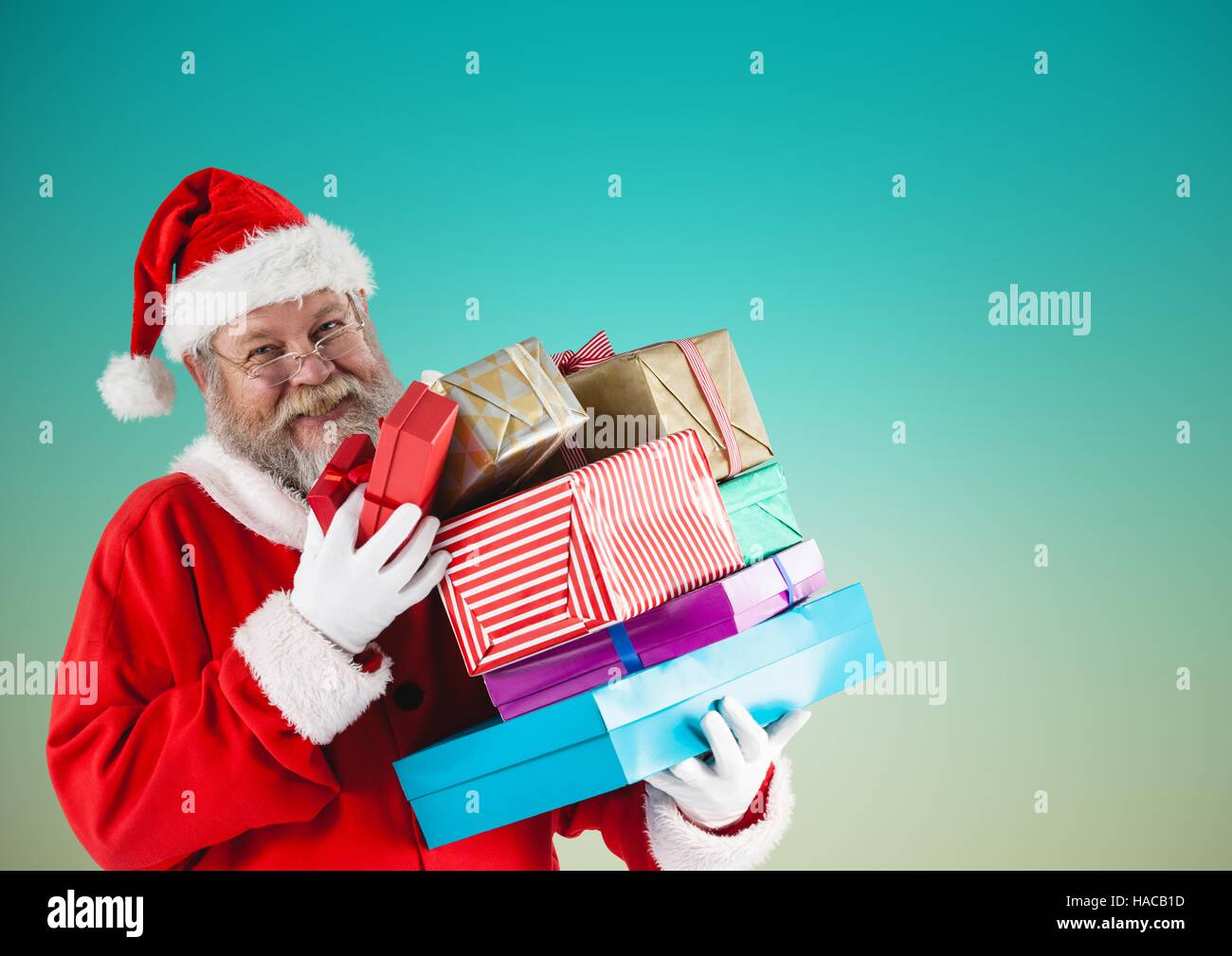 Santa claus holding gift boxes Stock Photo - Alamy