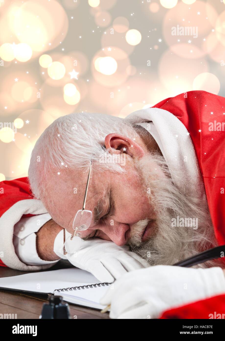 Tired santa claus sleeping at table Stock Photo - Alamy