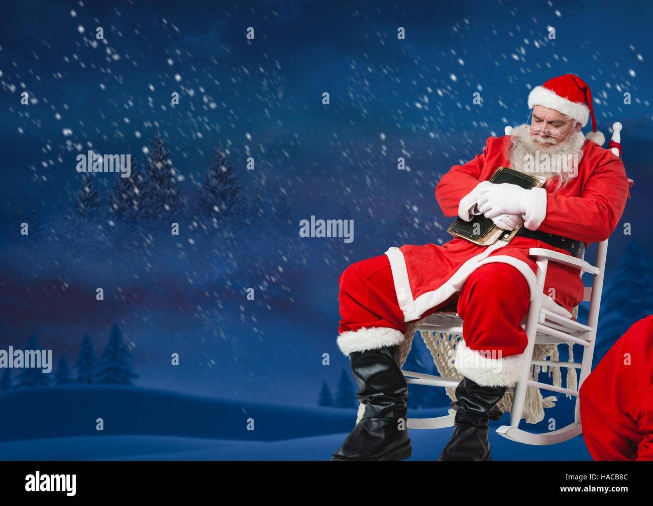 Santa sitting on chair and sleeping Stock Photo - Alamy