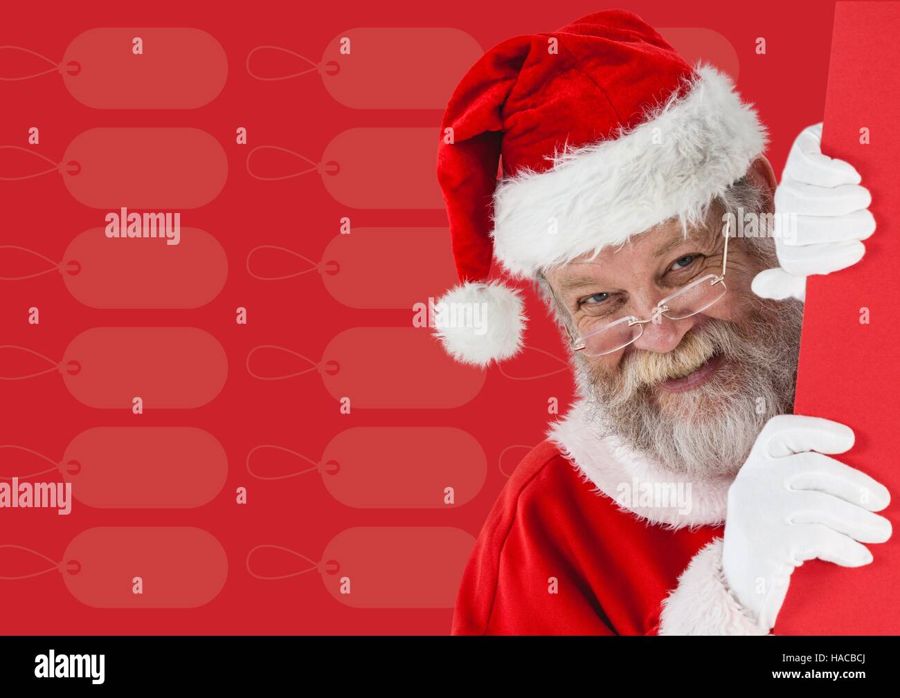 Smiling santa claus peeking from behind the wall Stock Photo - Alamy