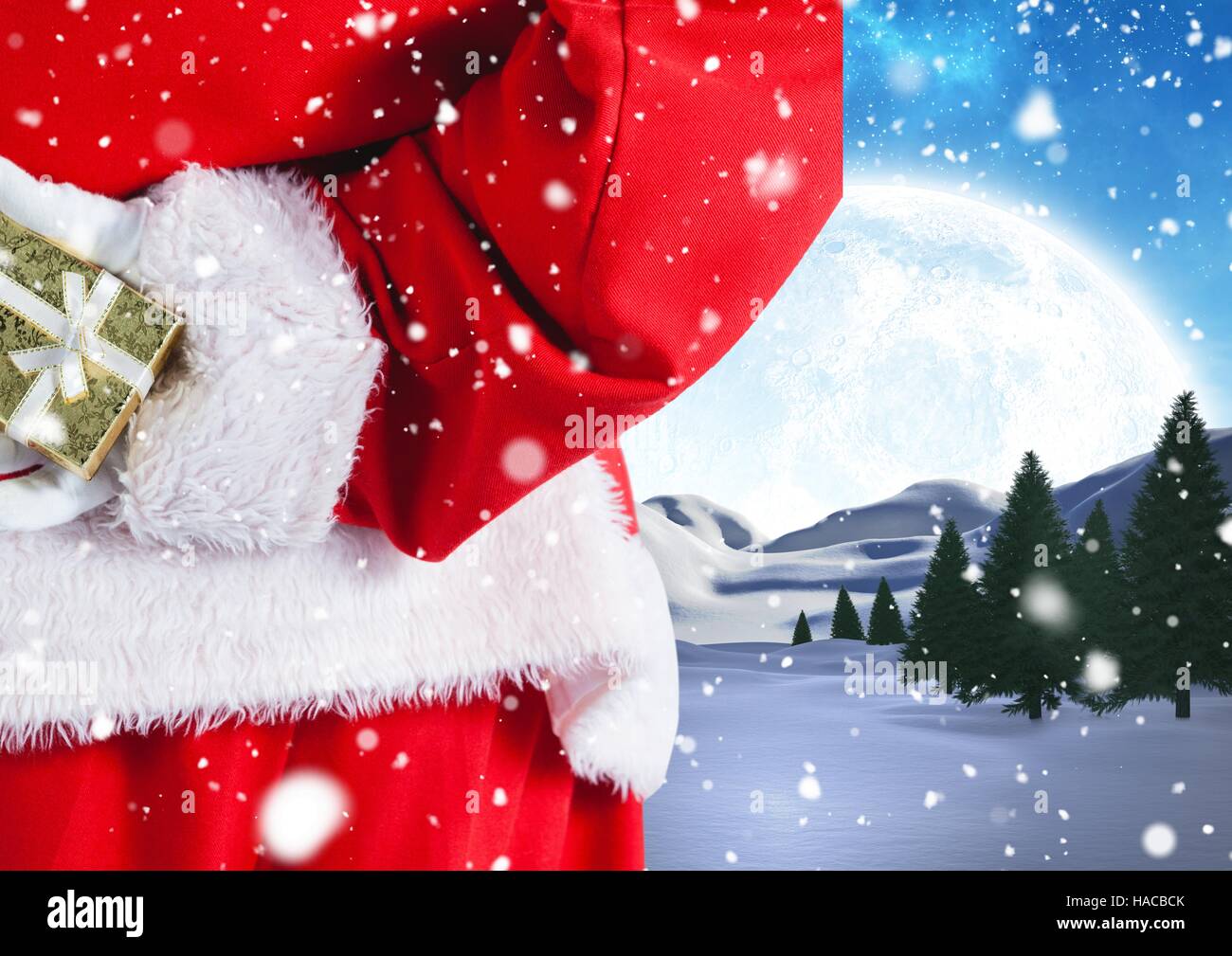 Santa behind the tree hi-res stock photography and images - Alamy