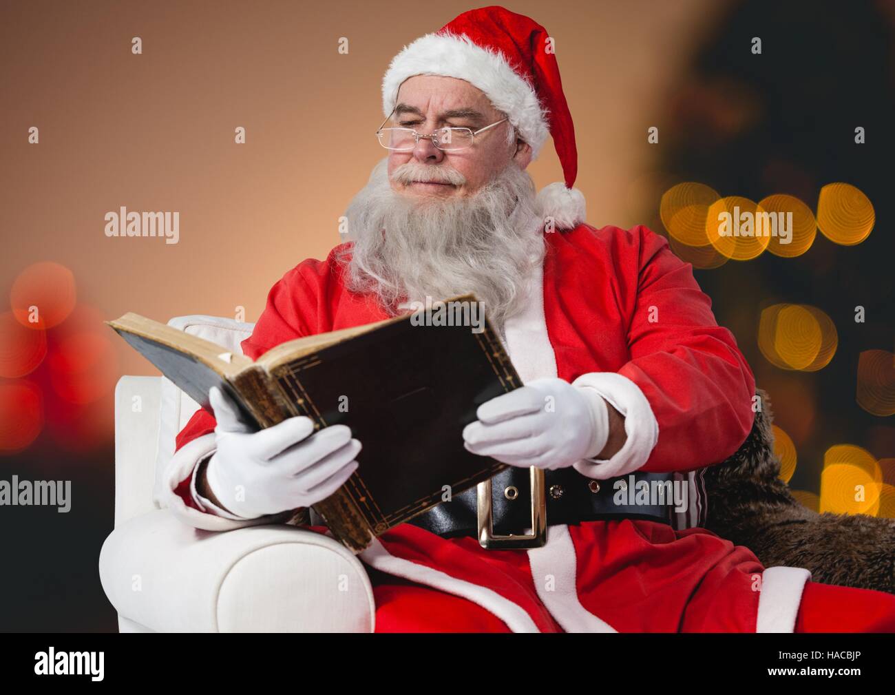 Santa reading a book hi-res stock photography and images - Alamy