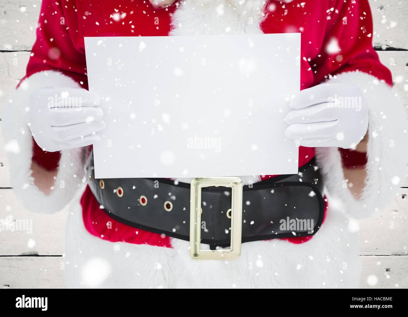 Mid-section of santa holding blank placard Stock Photo - Alamy