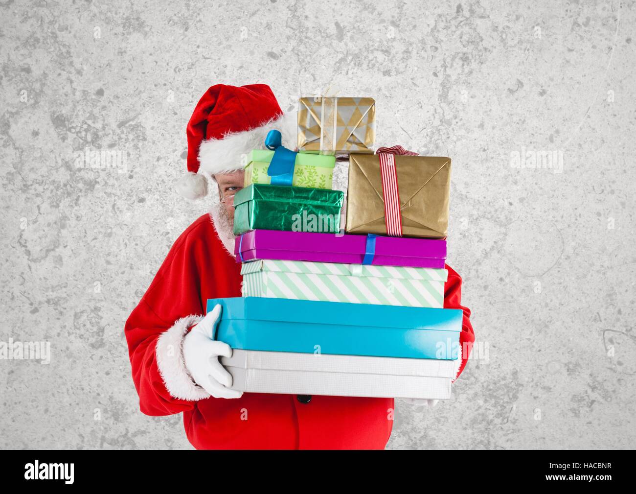 Santa claus holding gift boxes Stock Photo - Alamy
