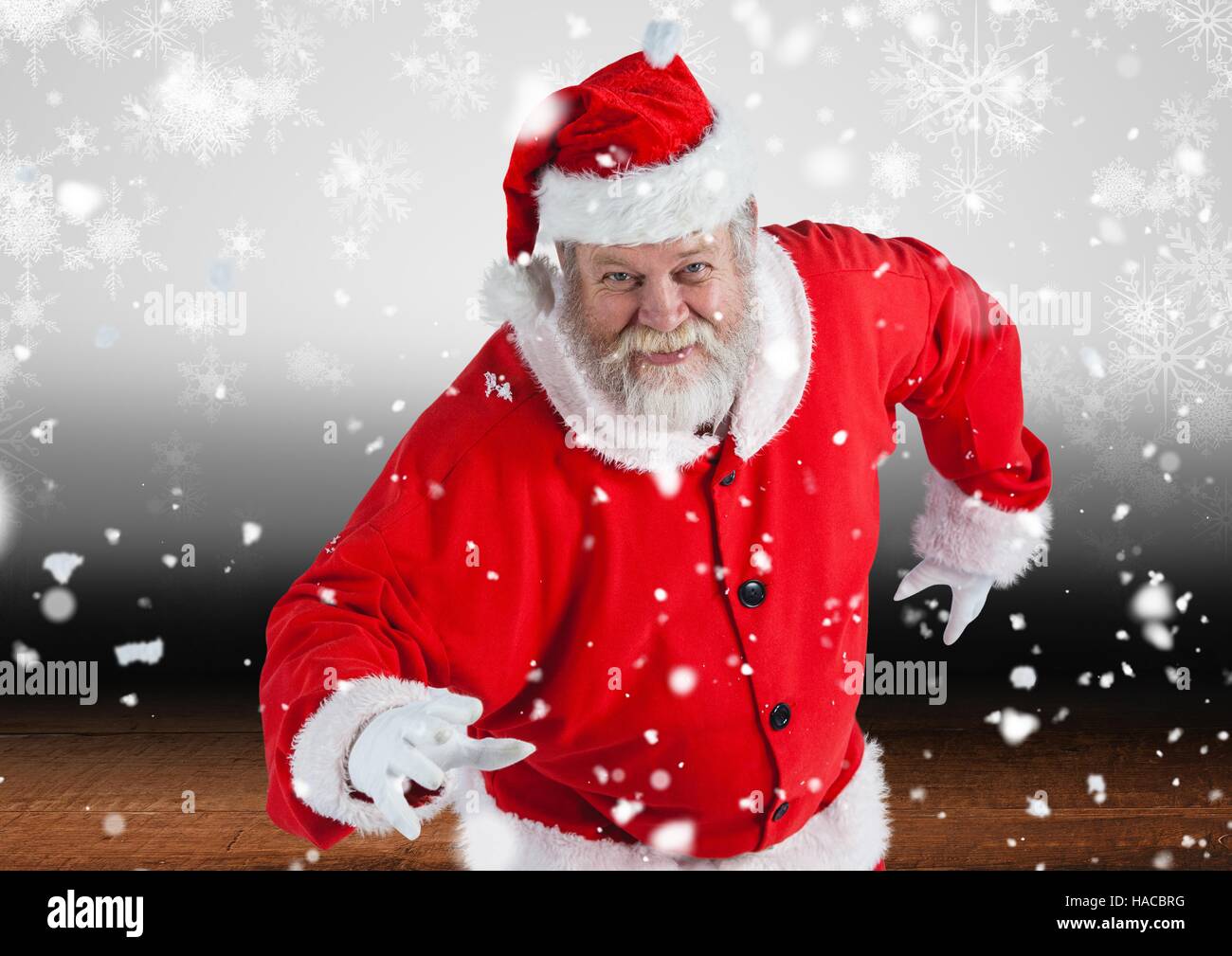 Santa claus posing in snow fall Stock Photo - Alamy