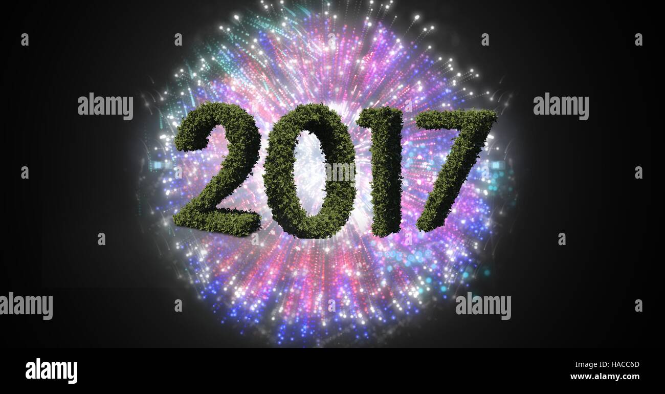 2017 made of green grass against composite image 3D of fireworks Stock ...
