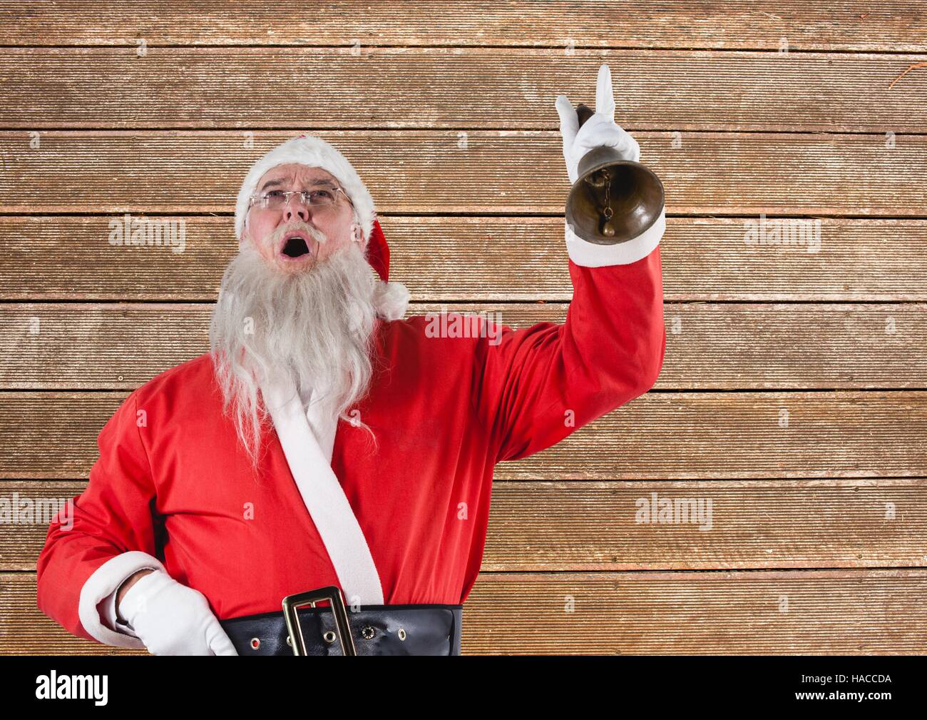Santa claus ringing a bell Stock Photo - Alamy