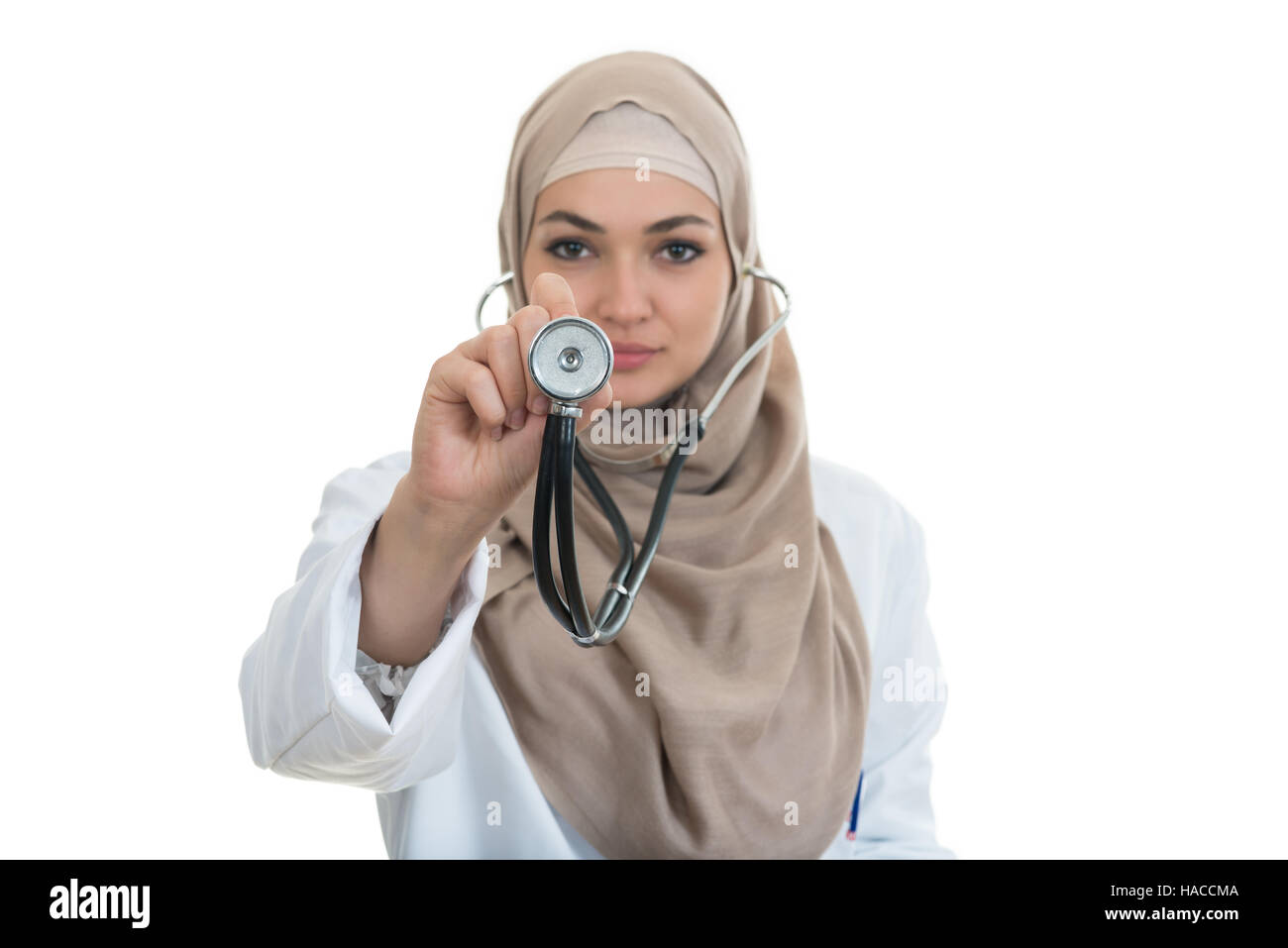close up portrait of arab female doctor smiling while using stethoscope ...