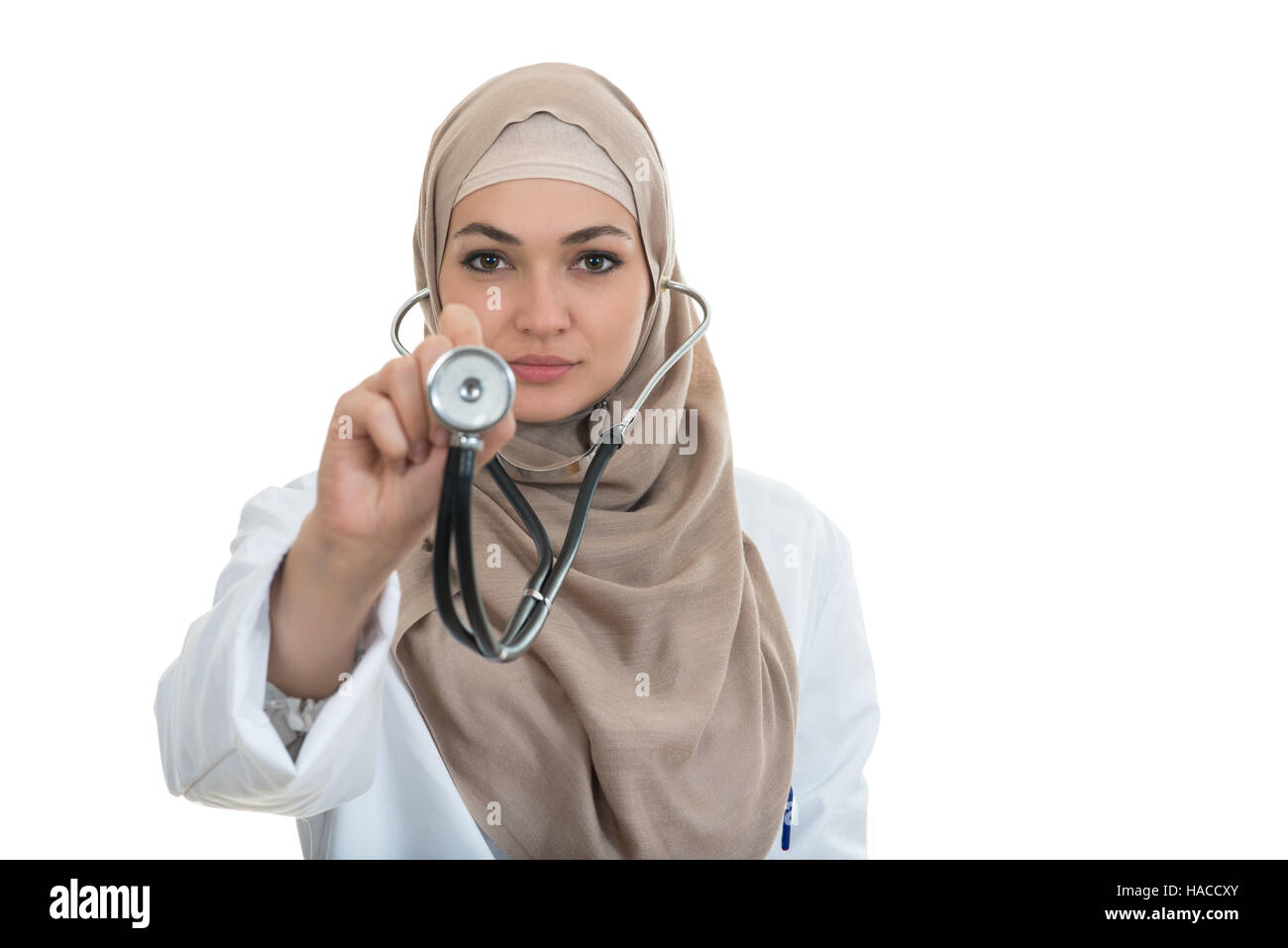 close up portrait of arab female doctor smiling while using stethoscope ...