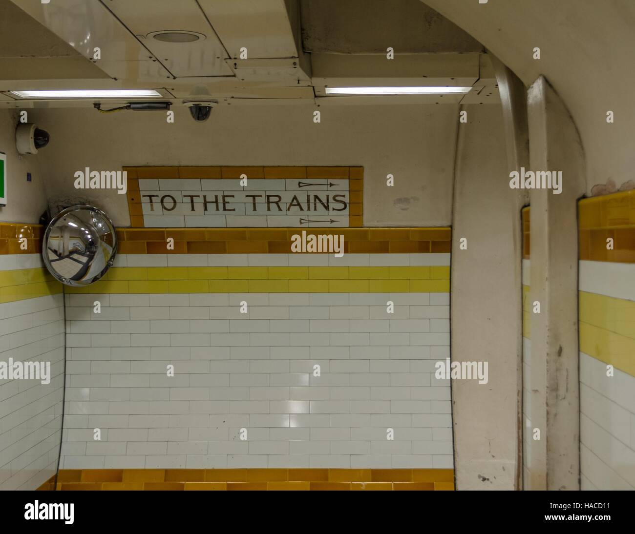 An example of a tiled "to the trains" sign, London underground, London ...
