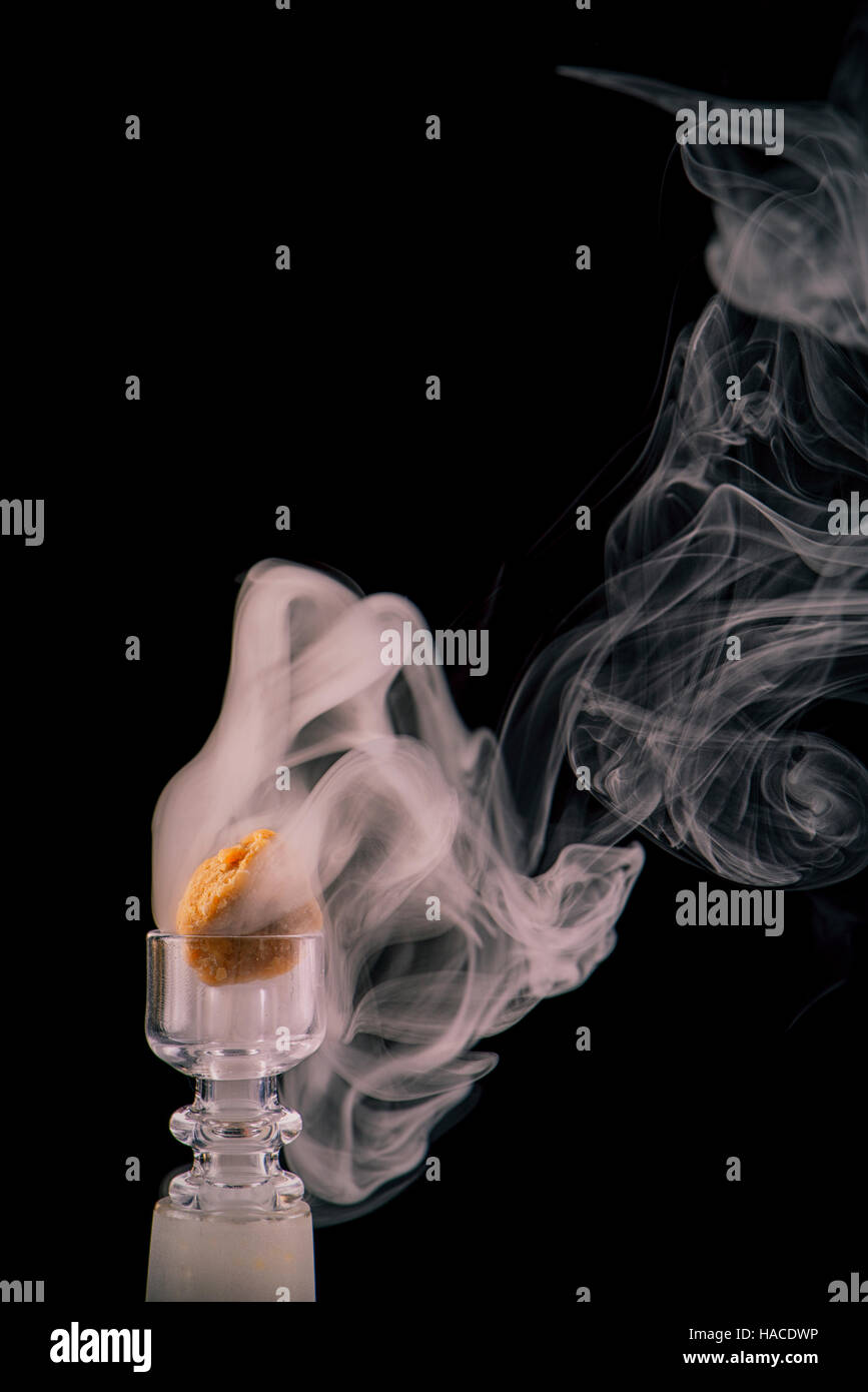 Marijuana extraction concentrate aka wax crumble on a glass rig with ...