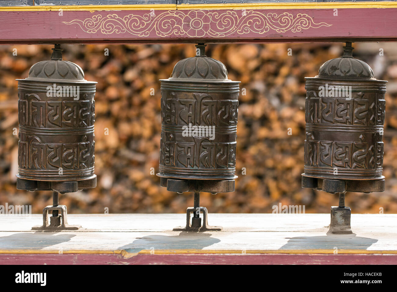 Buddhist prayer mani wall with prayer wheels in nepalese village on the ...