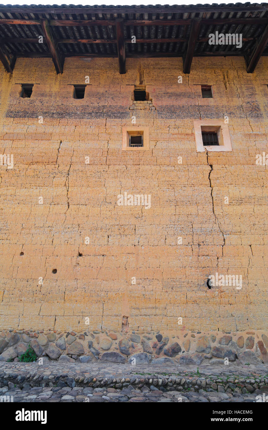 Cracks on the wall of a Fujian earthen building (Tulou) at Yongding ...