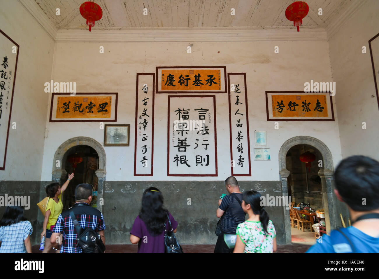 Tour guide explaining the meaning of the chinese calligraphy writing in ...