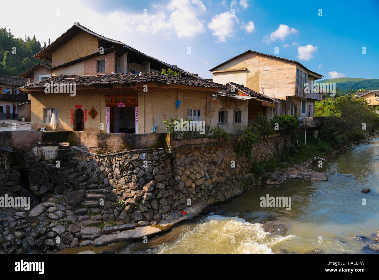 Chinese rural housing beside a running river at Yongding town, Fujian ...