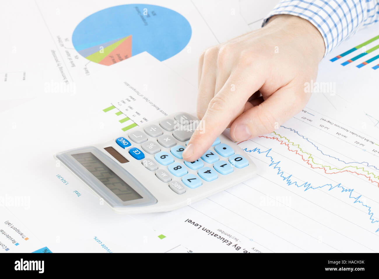 Male pushing calculator buttons as symbol of financial world Stock ...