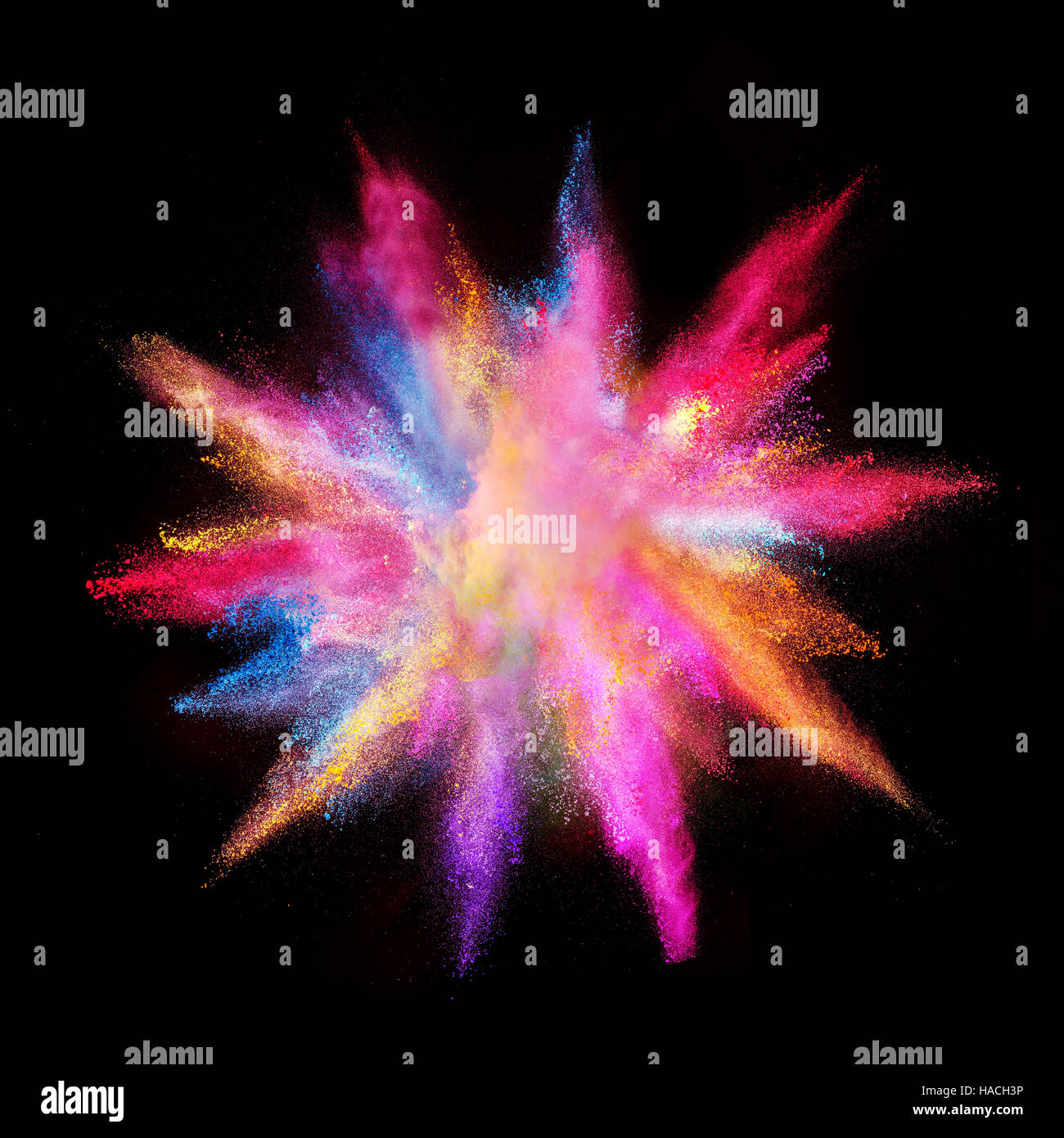 Colored powder explosion isolated on black background Stock Photo - Alamy