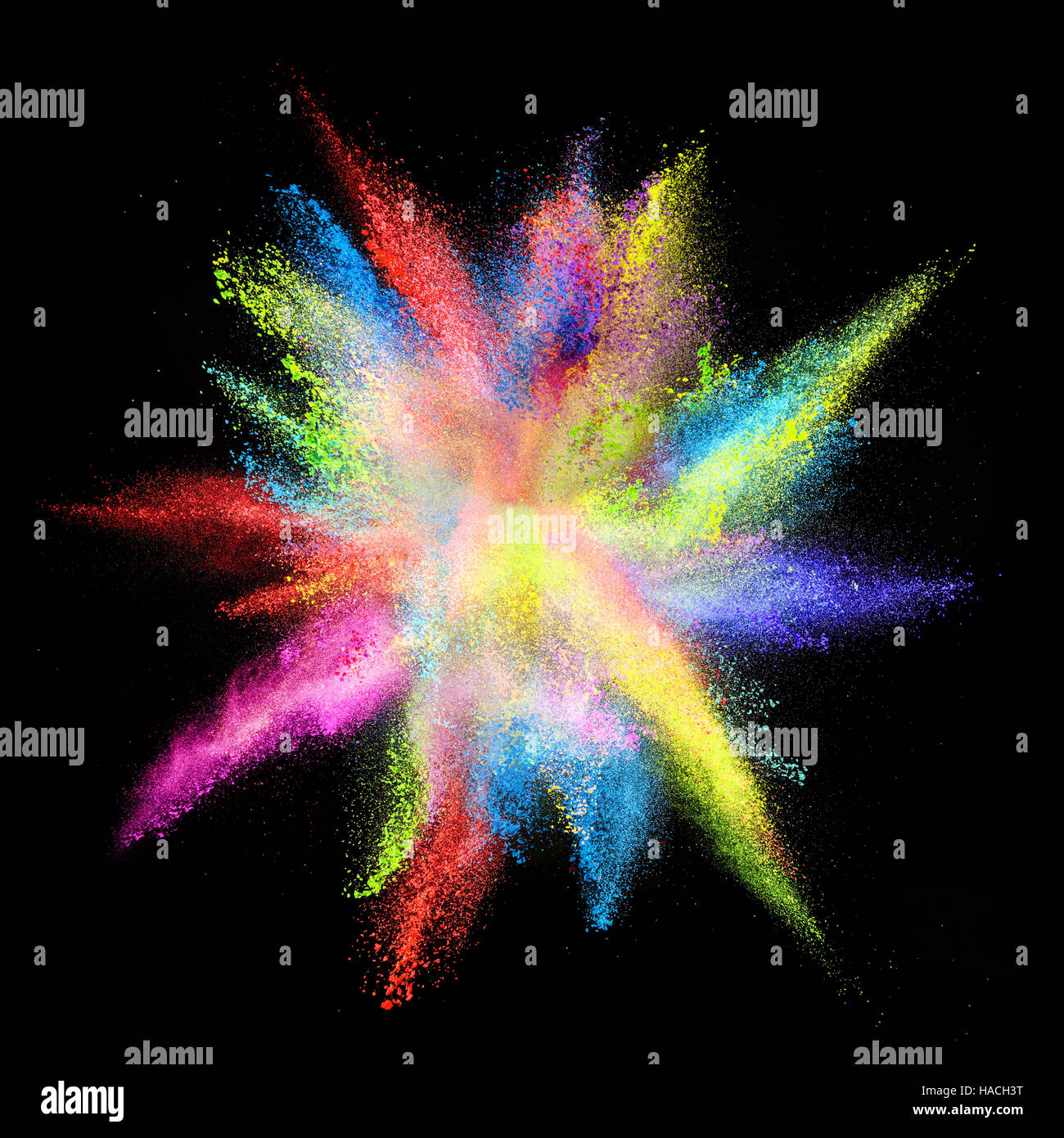 Colored powder explosion isolated on black background Stock Photo - Alamy