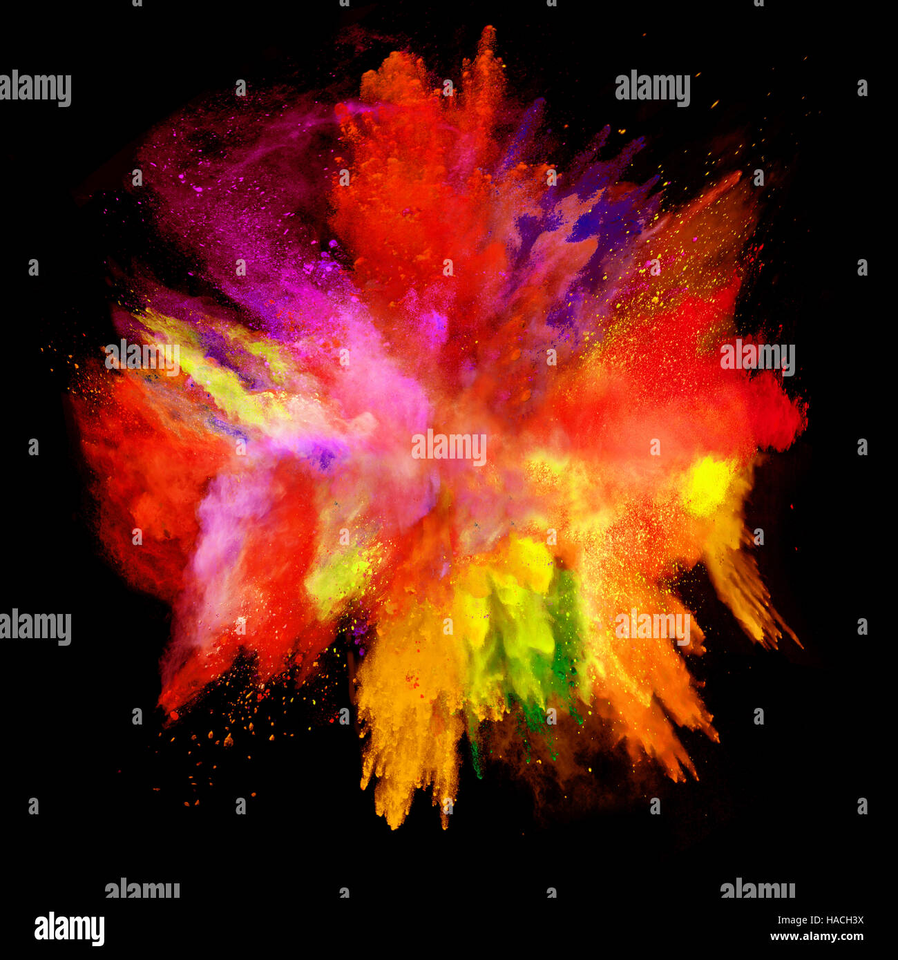 Colored powder explosion isolated on black background Stock Photo - Alamy