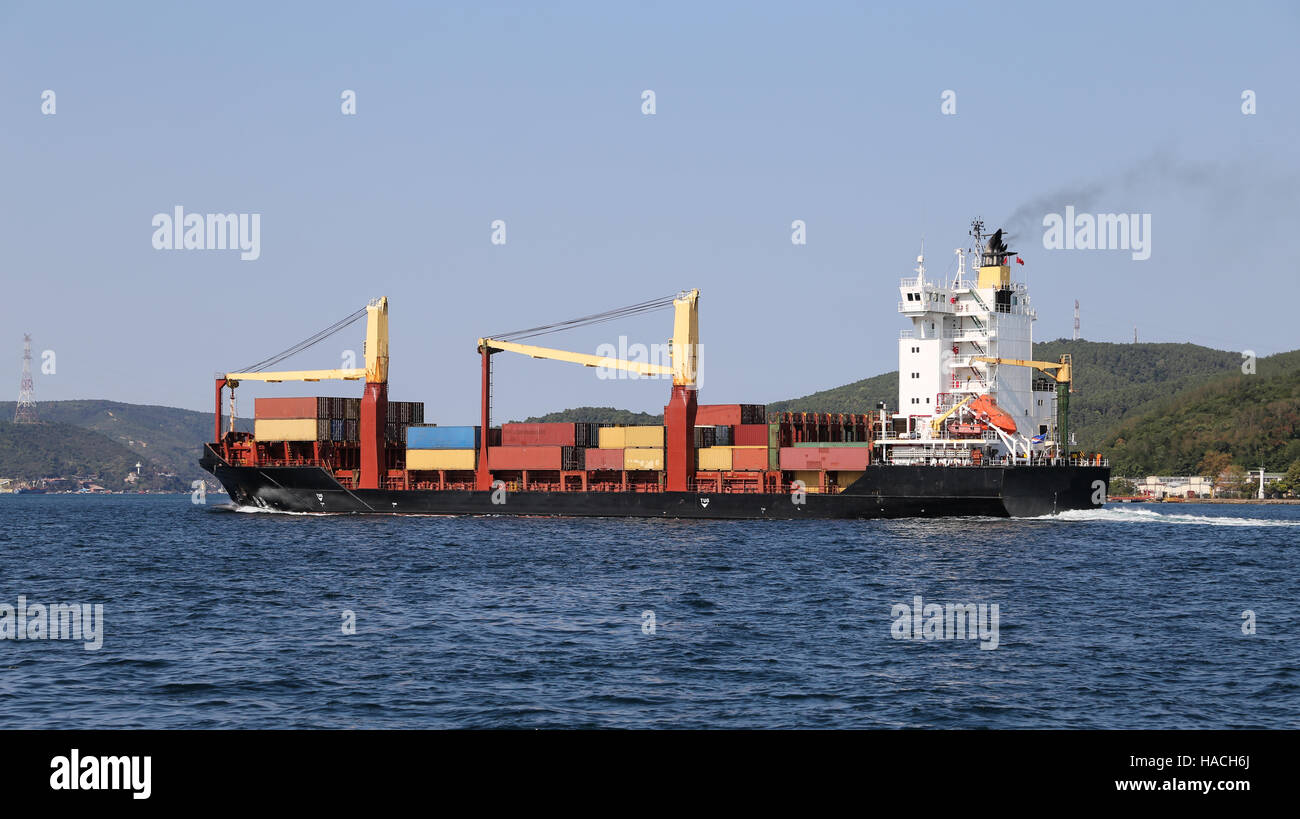 A container ship carrying goods between ports Stock Photo - Alamy