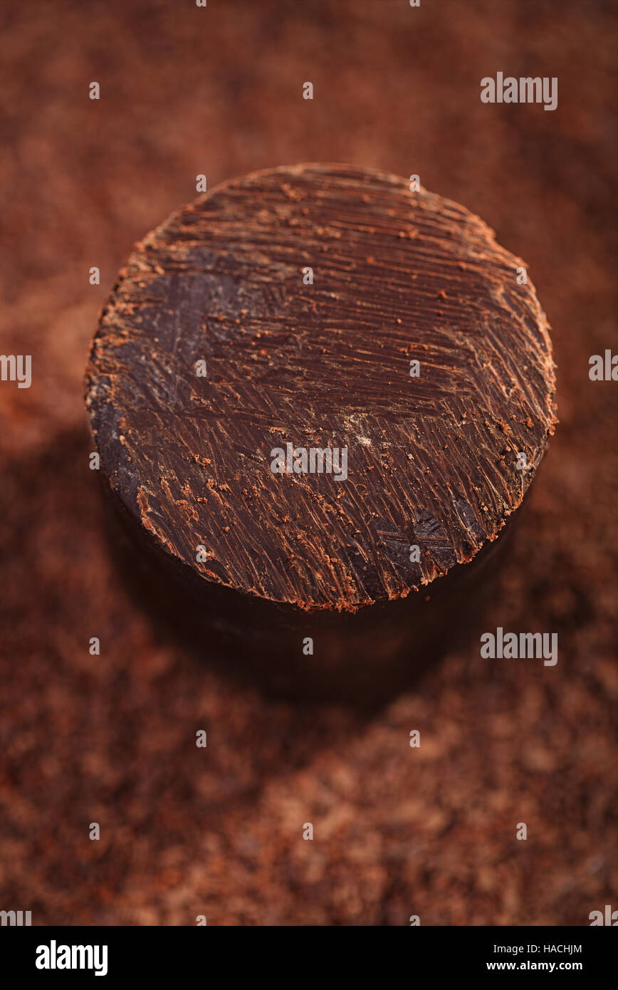 solid dark 100% chocolate on grated chocolate background Stock Photo ...
