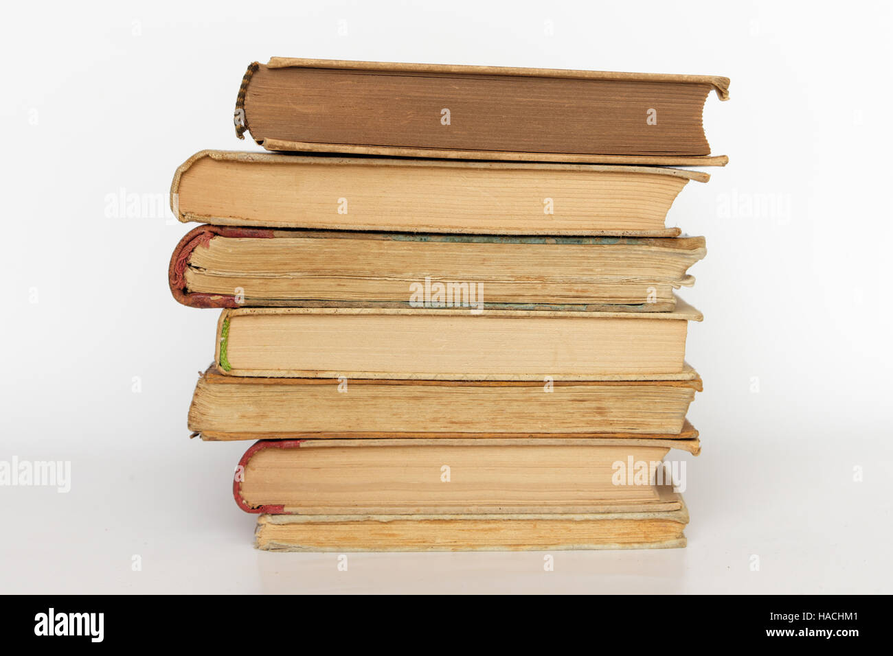 stack of old books isolated on white background Stock Photo - Alamy