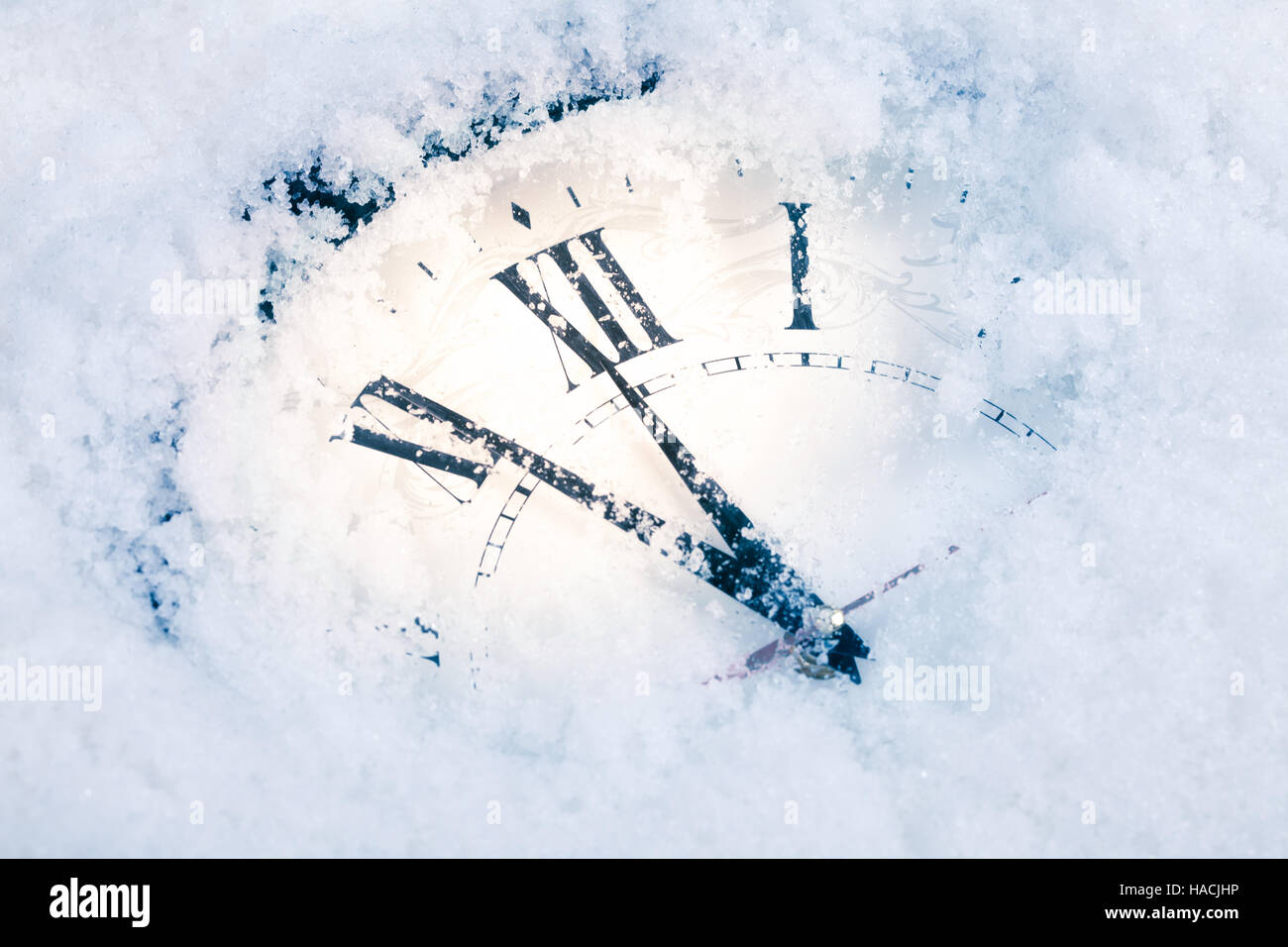 Christmas Time Clock under snow. studio shot Stock Photo - Alamy