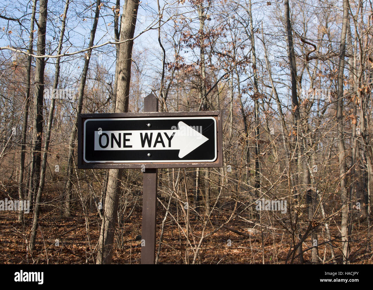 A one way sign on a rural road Stock Photo - Alamy