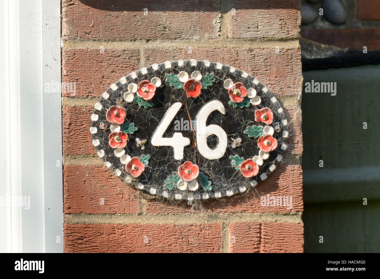 House Number 46 ceramic tile sign on wall Stock Photo - Alamy