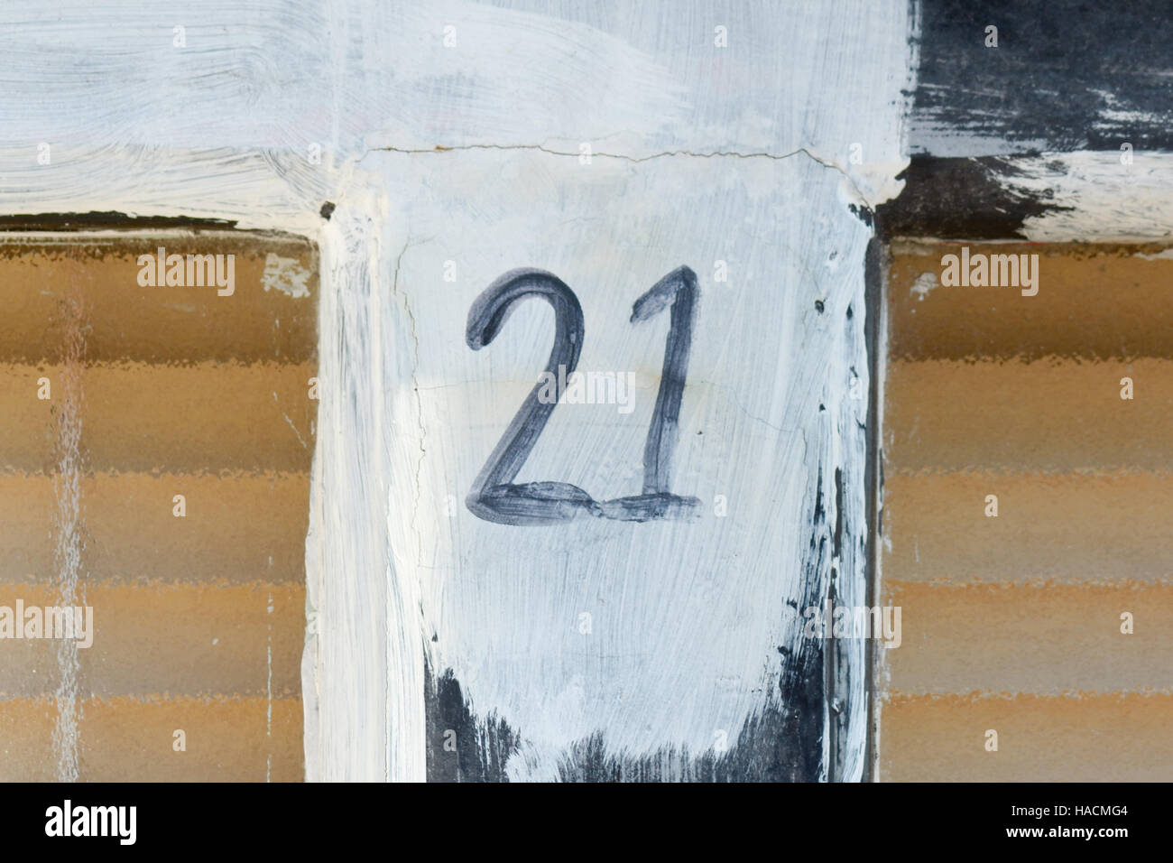 House Number 21 painted sign on door Stock Photo - Alamy