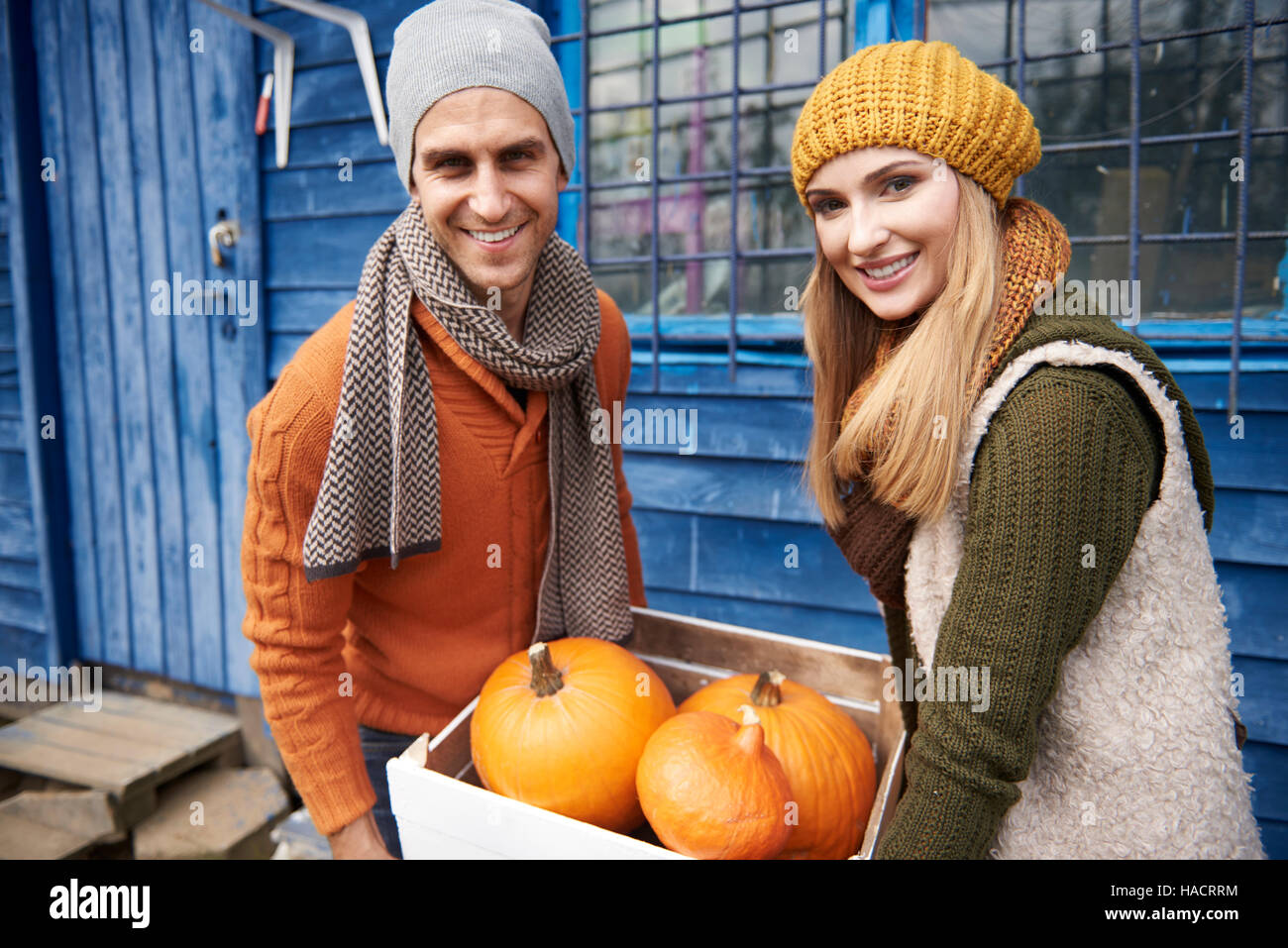 Happy couple with organic pumpkins Stock Photo - Alamy