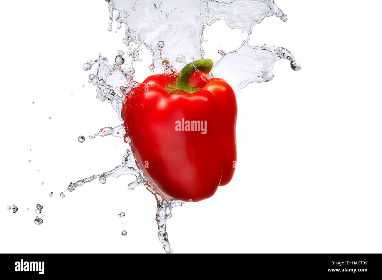 Water splash with bell pepper isolated Stock Photo - Alamy