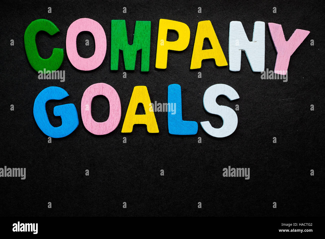 Colorful wooden letters forming the phrase "company goals Stock Photo ...