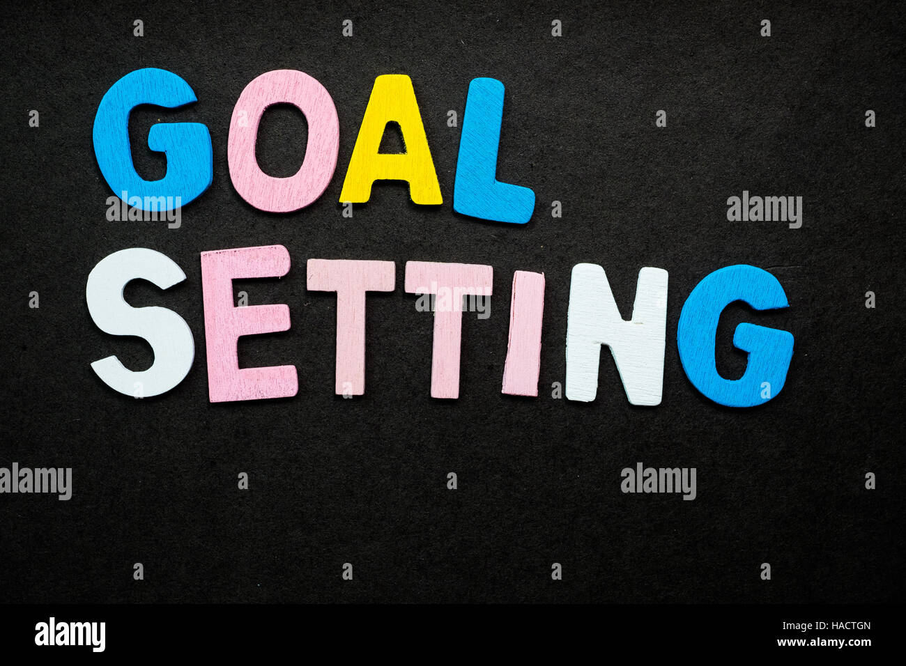 Colorful wooden letters forming the phrase "goal setting Stock Photo ...