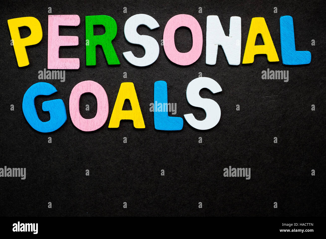 Colorful wooden letters forming the phrase "personal goals Stock Photo ...