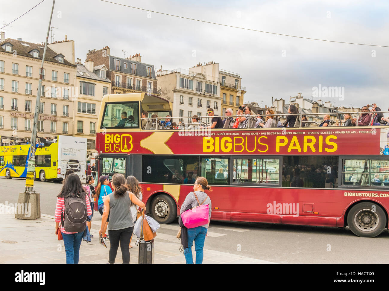 tourists on board of a sight-seeing-bus of the big bus fleet passing ...