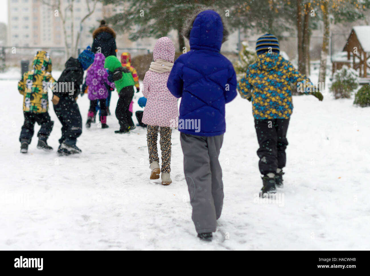 Children on walk in kindergarten in the winter Stock Photo - Alamy