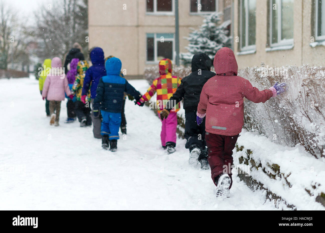 Children on walk in kindergarten in the winter Stock Photo - Alamy