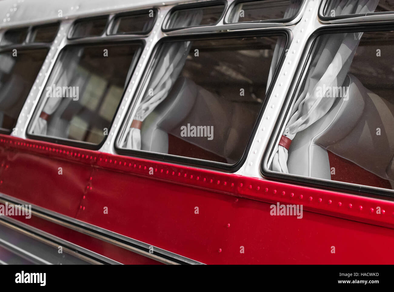 Part of red retro bus with passenger seats Stock Photo - Alamy