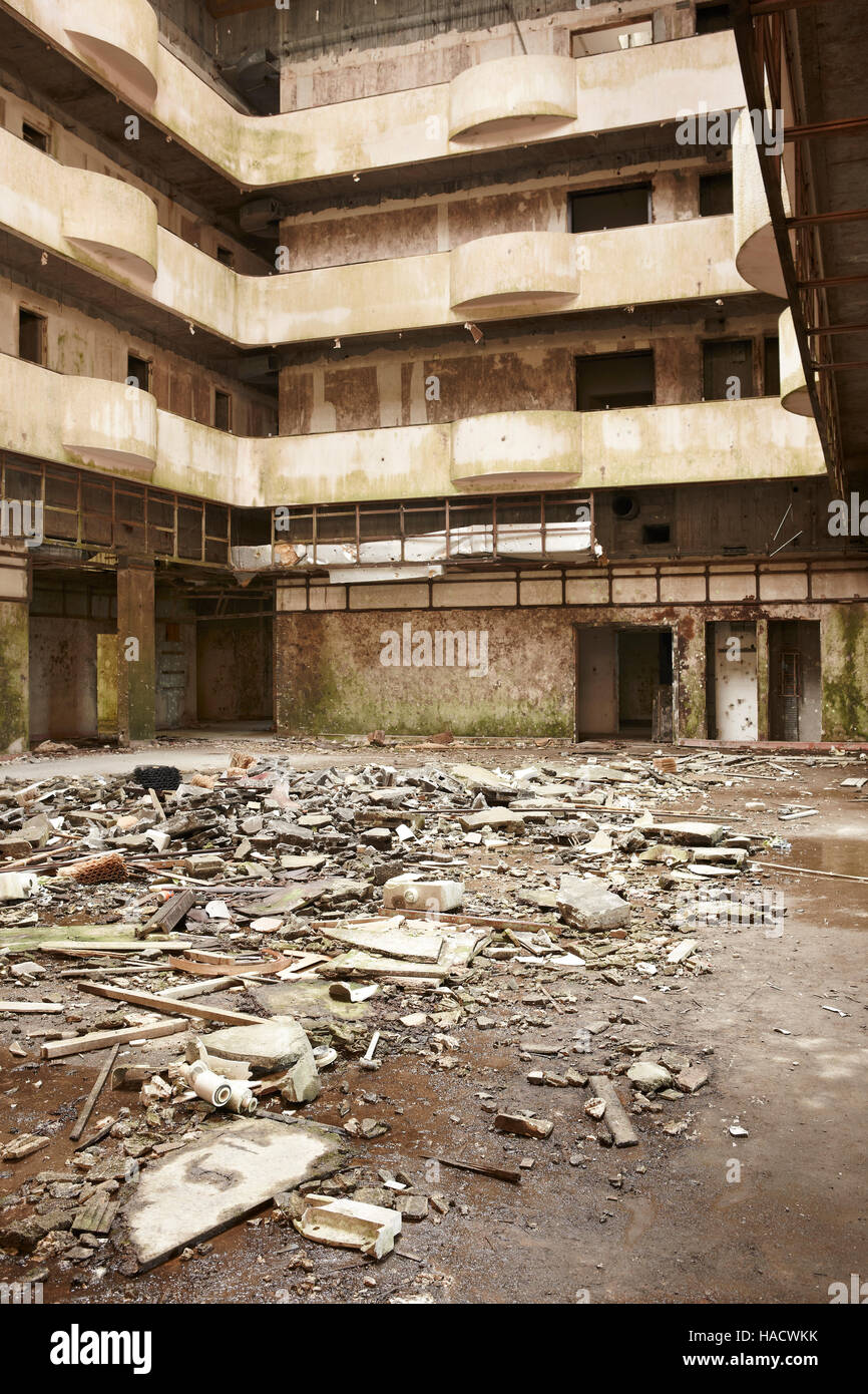 Dirty abandoned building interior in ruins in warm tone. Vertical ...