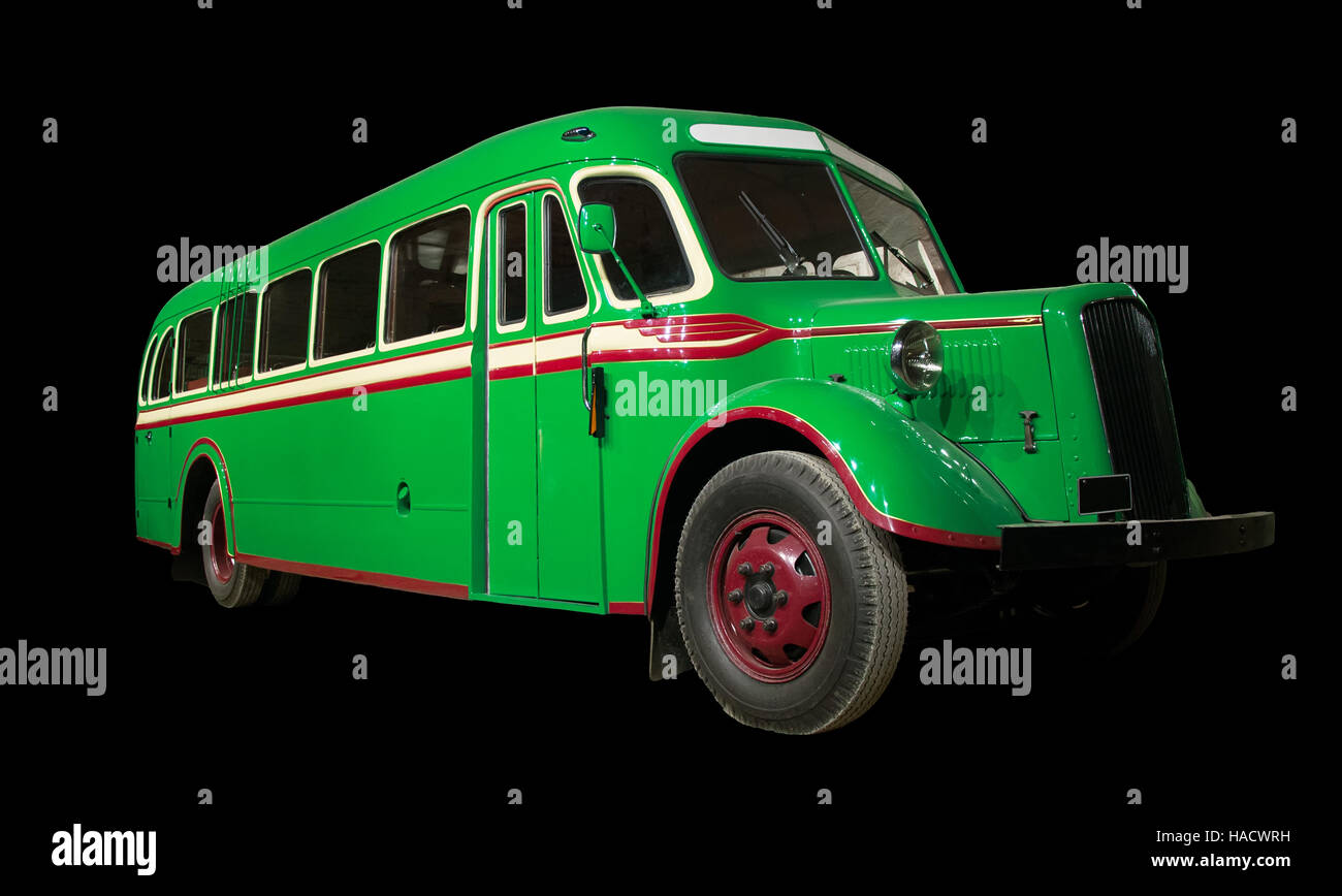 Old retro green bus. Isolated on black background Stock Photo - Alamy