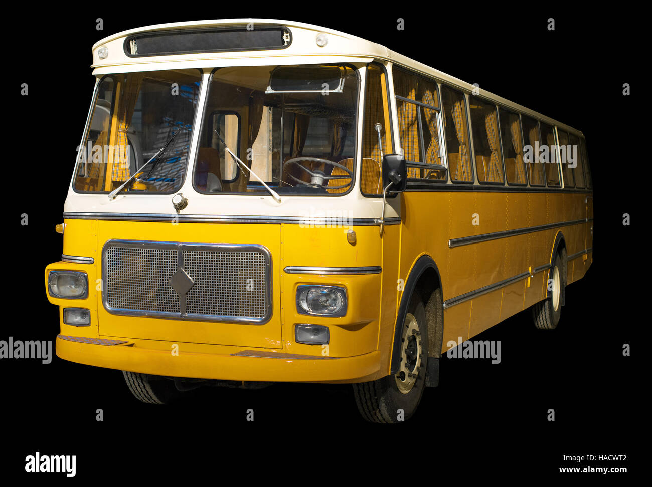 Old retro yellow bus. Isolated on black background Stock Photo - Alamy
