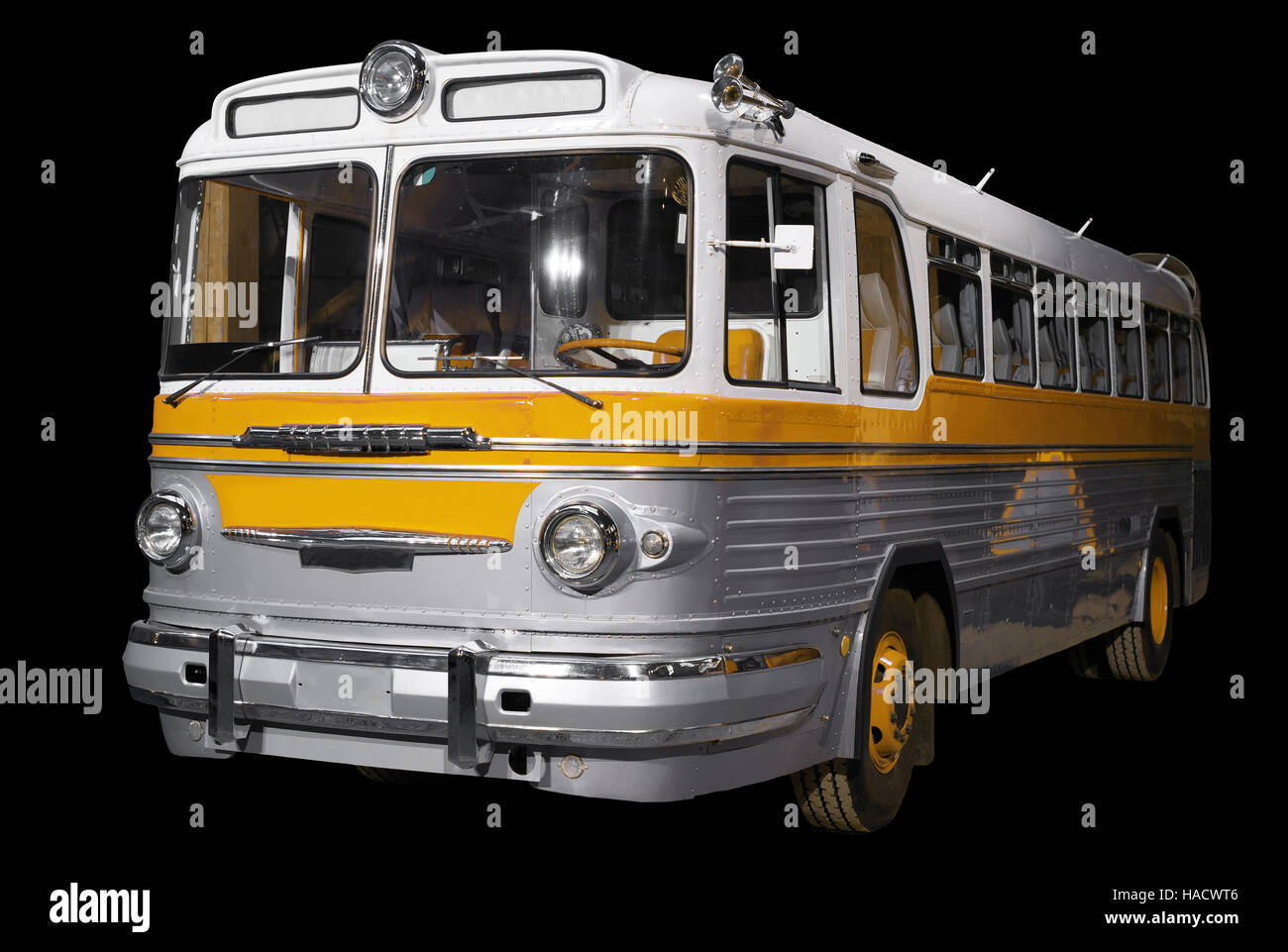 Old retro yellow bus. Isolated on black background Stock Photo - Alamy
