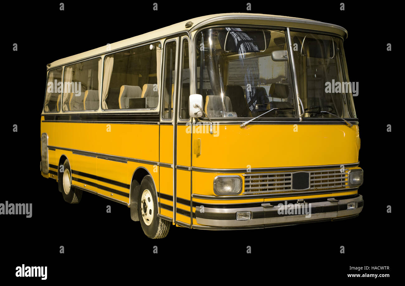 Old retro yellow bus. Isolated on black background Stock Photo - Alamy