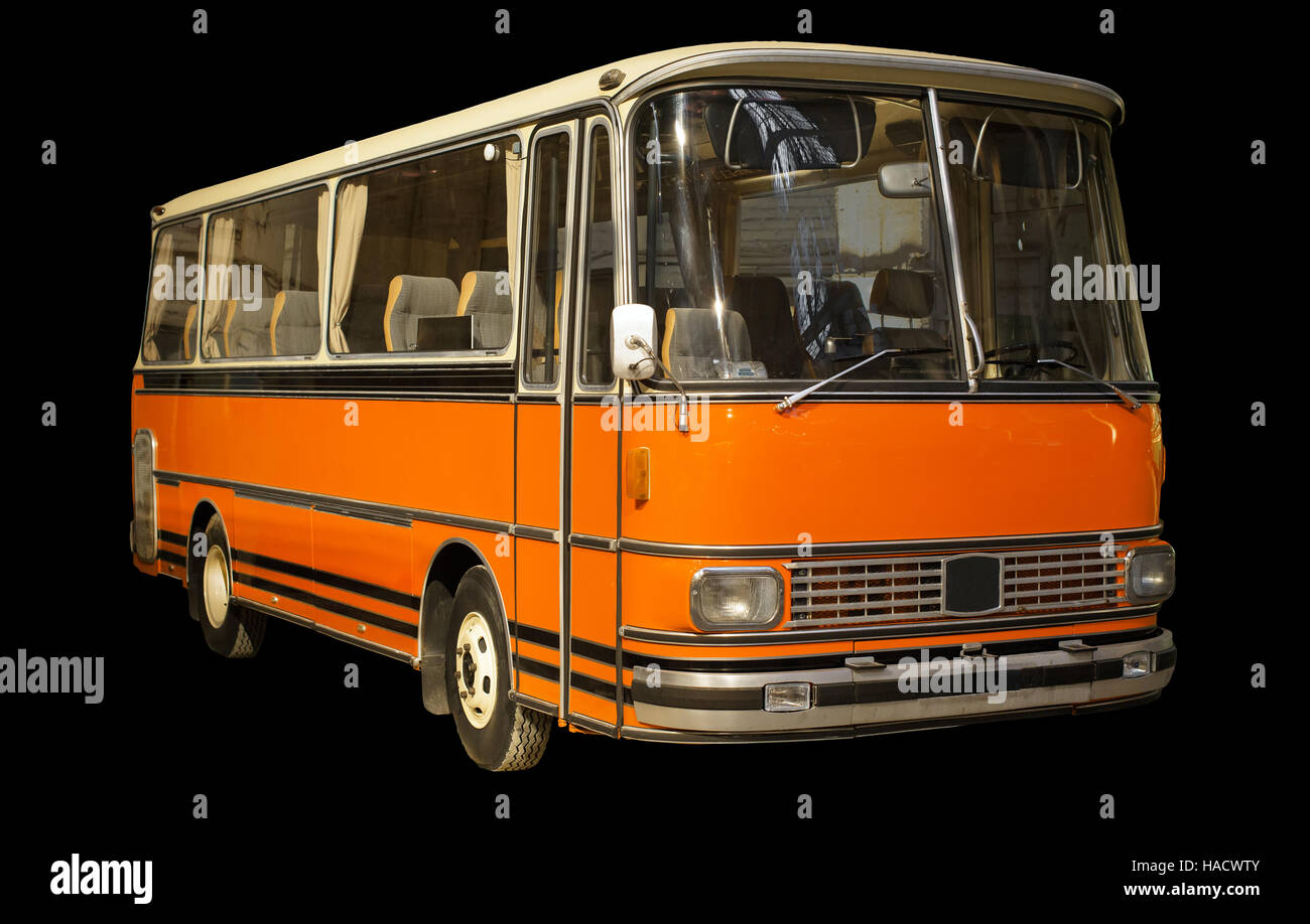 Old retro orange bus. Isolated on black background Stock Photo - Alamy
