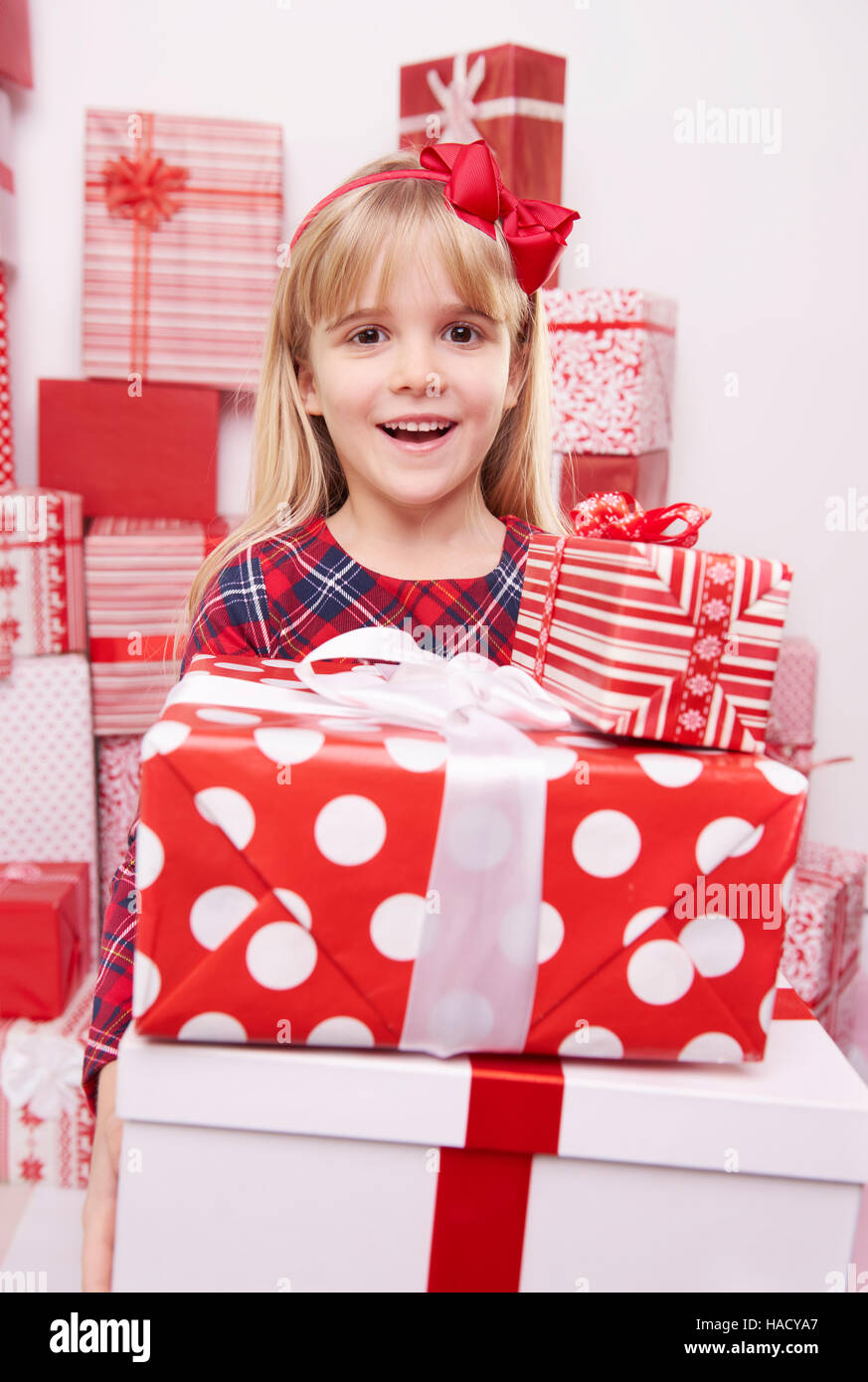 Surprised girl holding gift hi-res stock photography and images - Alamy