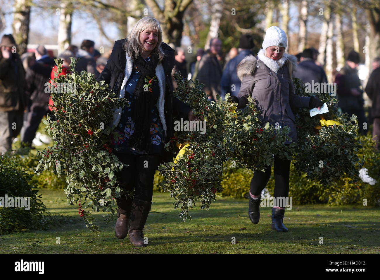 Silvija Larmane (left) and her daughter Aiva (right) carry their ...