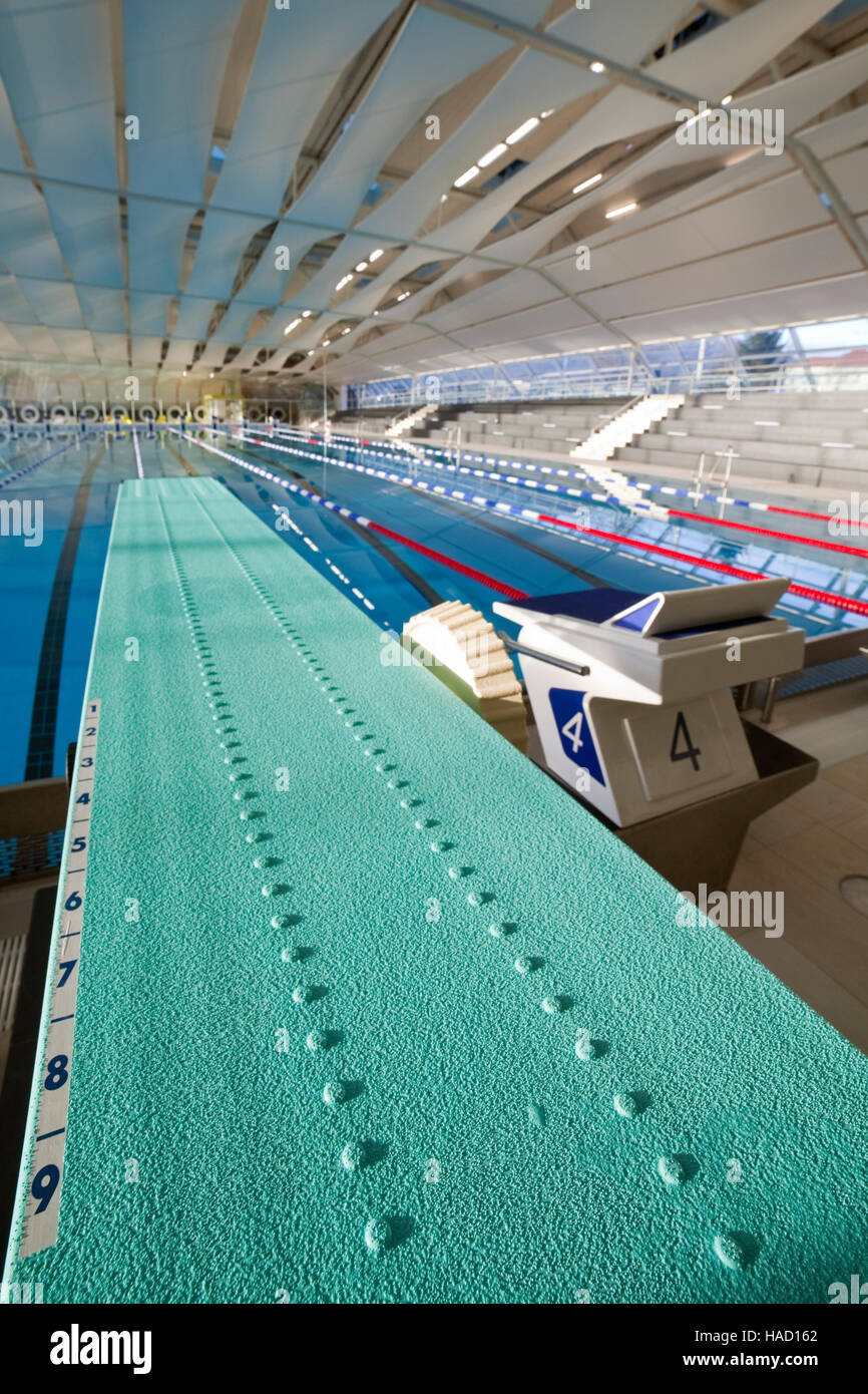Green spring board in modern indoor swimming pool Stock Photo - Alamy