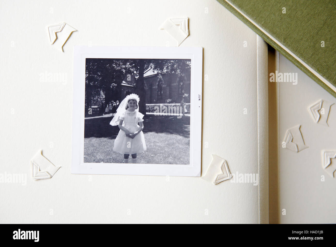 Photo album, scrap book with First Communion photograph Stock Photo - Alamy